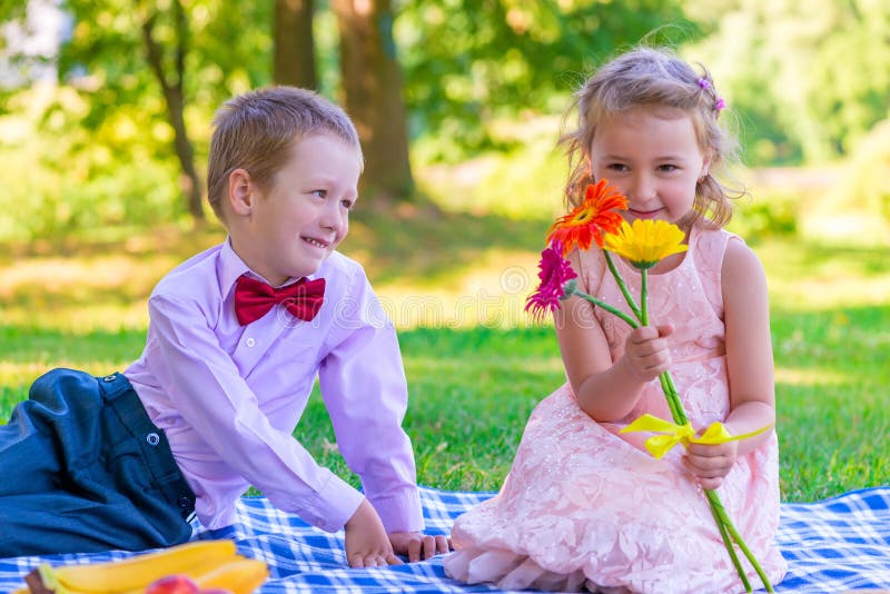 6 Year Old Children on a Date in the Park Stock Image - Image of grass ...