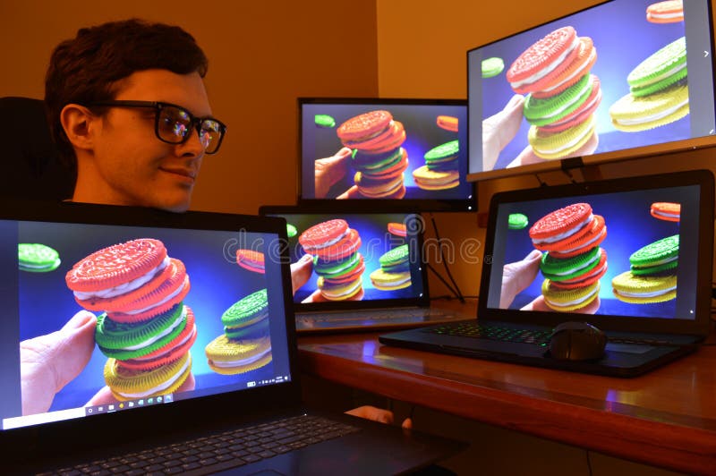 Man Working in Office with Multiple Computer Screens Stock Photo ...