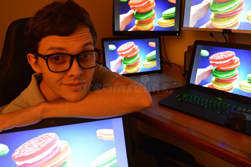 Man Working in Office with Multiple Computer Screens Stock Image ...