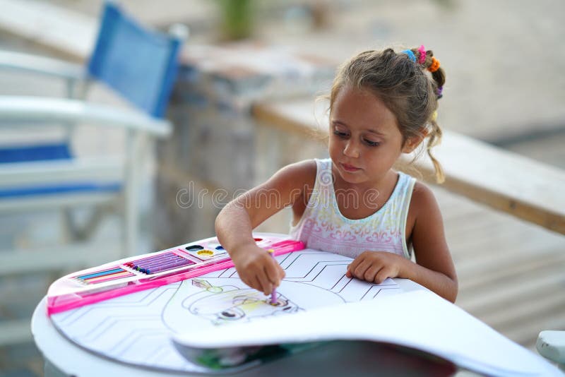 4-year-old Girl Colors with Interest Stock Image - Image of casual ...