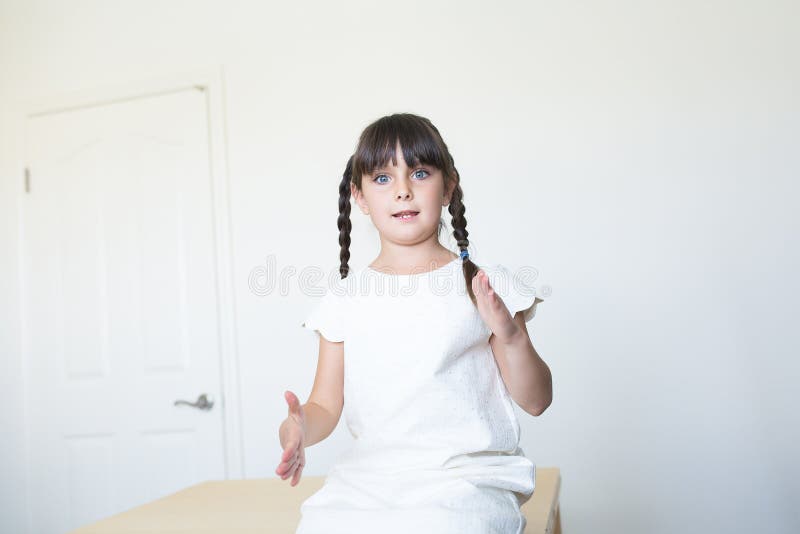 Child Communicating with Hands Stock Photo - Image of casual, blue ...