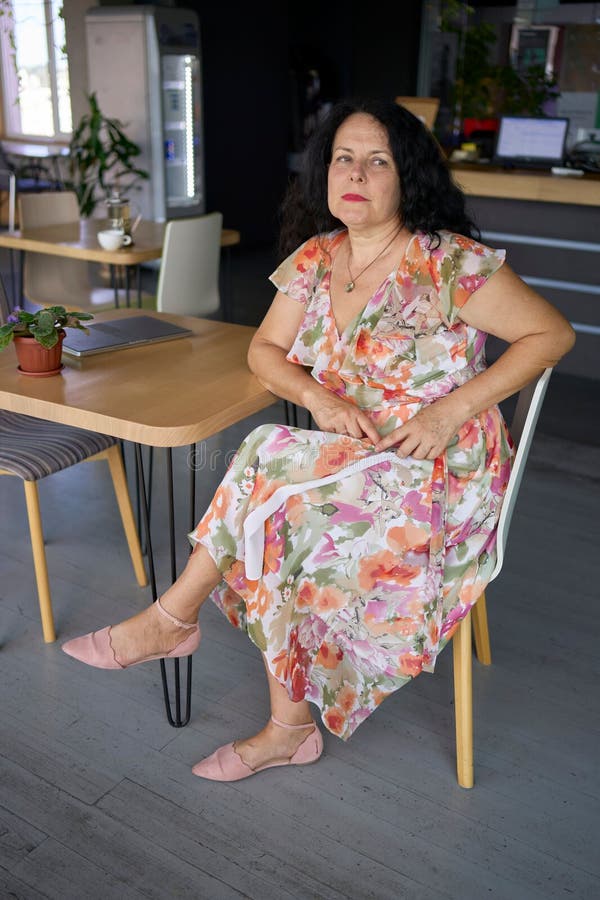 57-year-old Woman Works on a Laptop in a Modern Office Workspace Stock ...