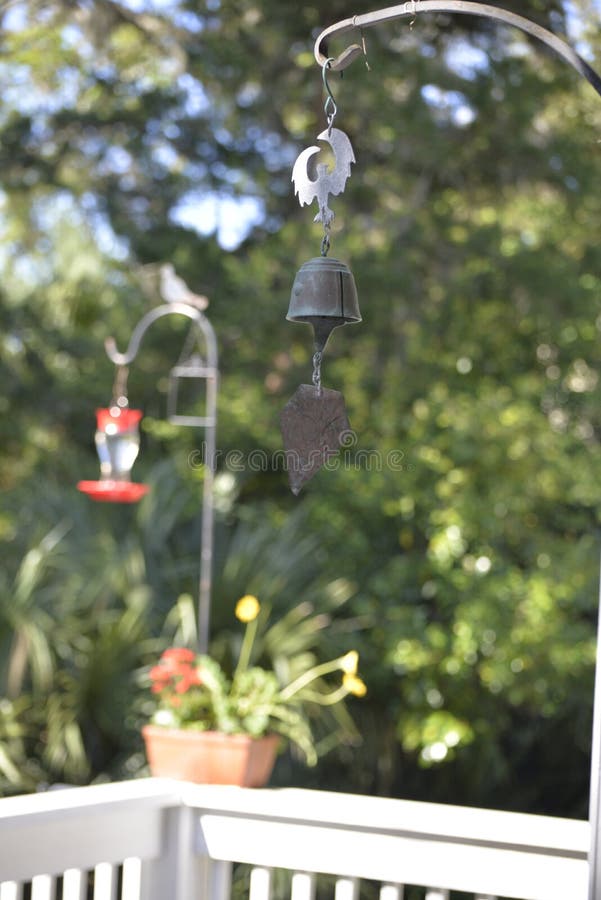 A Wind Chime Adds a Nice Touch To a Beautiful Backyard Setting Stock ...