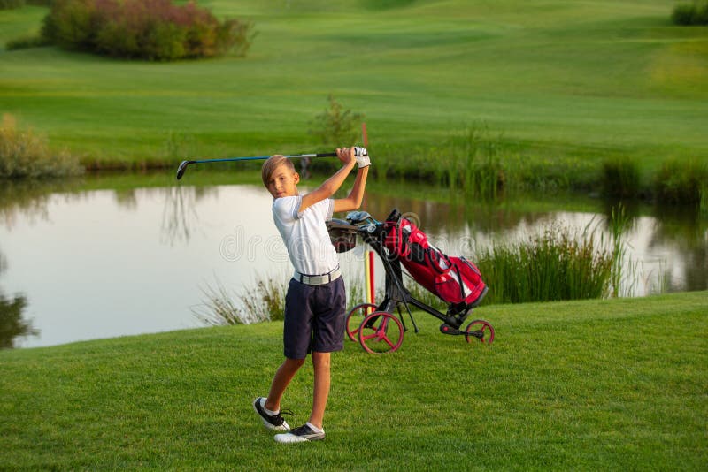 11 Years Old Boy Golfer Playing Golf Near a Lake Stock Photo - Image of ...
