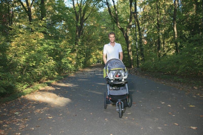 30 Years Old Man with a Stroller Walking in the Stock Photo - Image of ...