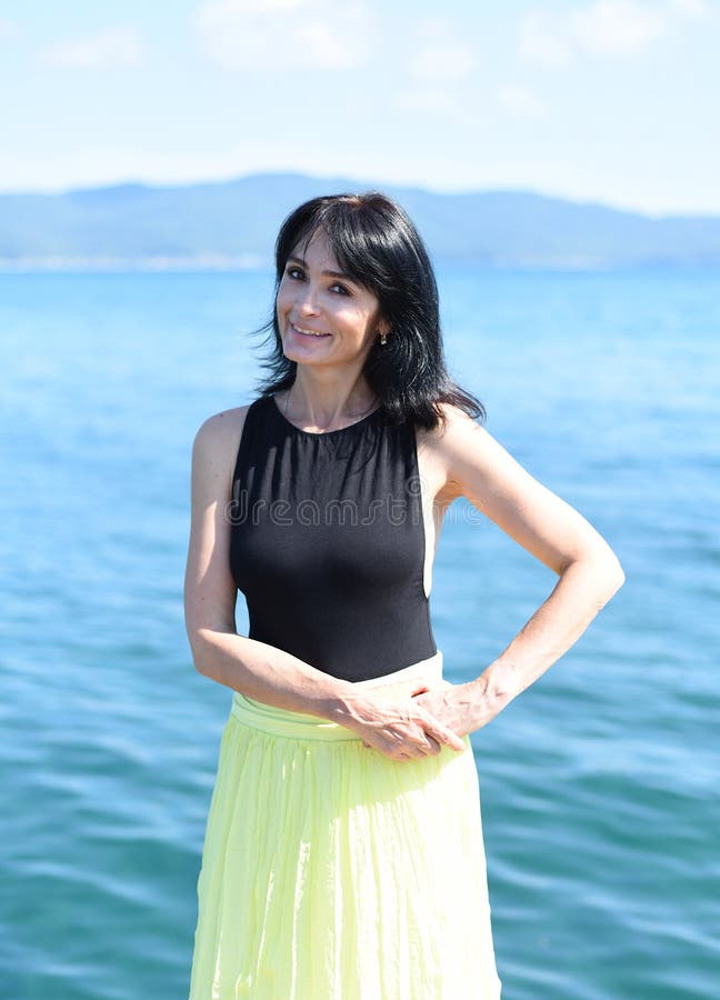 45 Years Old Russian Woman In Swimsuit Laughing And Standing In