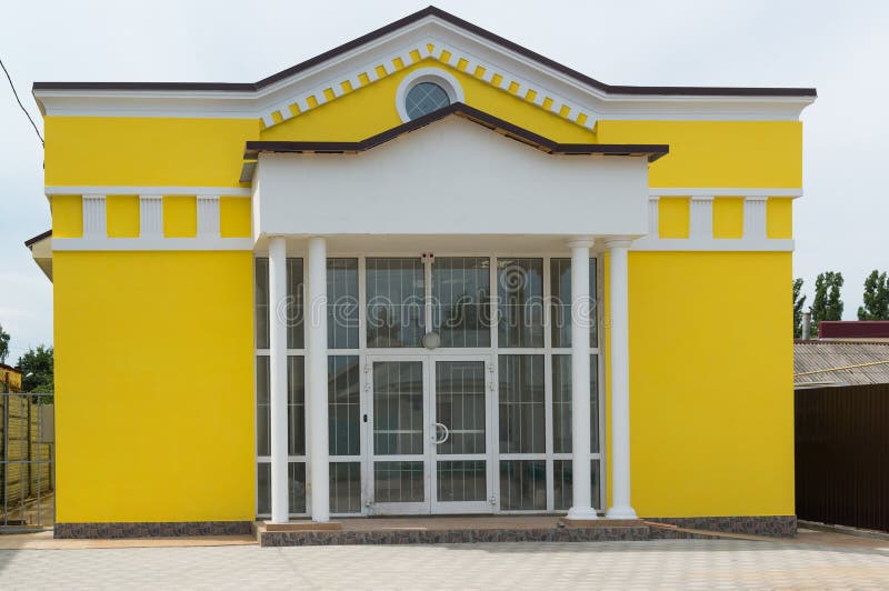 Yellow Administrative Office Building with Glass Doors Stock Photo ...