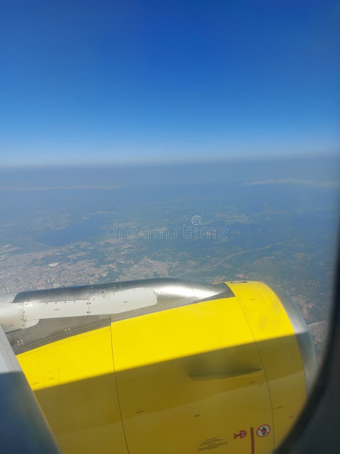 Yellow Airplane on the Sky... Big City Stock Photo - Image of airplane ...