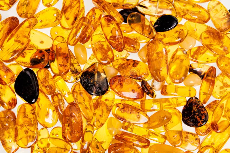 Yellow Amber Stones Lie on a Flat Surface. Stock Image - Image of brown ...