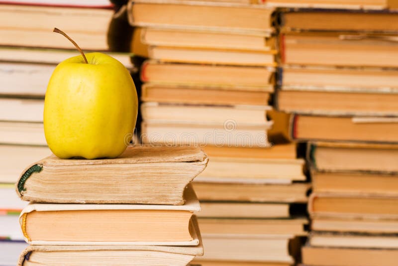 Yellow Apple on Stack of Books Stock Image - Image of education, public ...