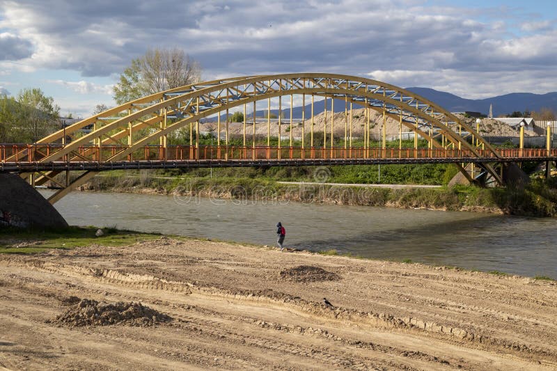 Yellow Arch Bridge Over River Person Crossing Stock Photos - Free ...