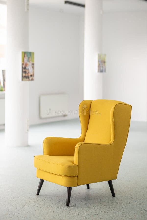 Yellow Armchair in the Middle of an Empty Room Stock Photo - Image of ...
