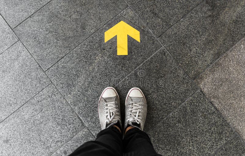 Yellow Arrow Direction on the Floor Stock Photo - Image of location ...
