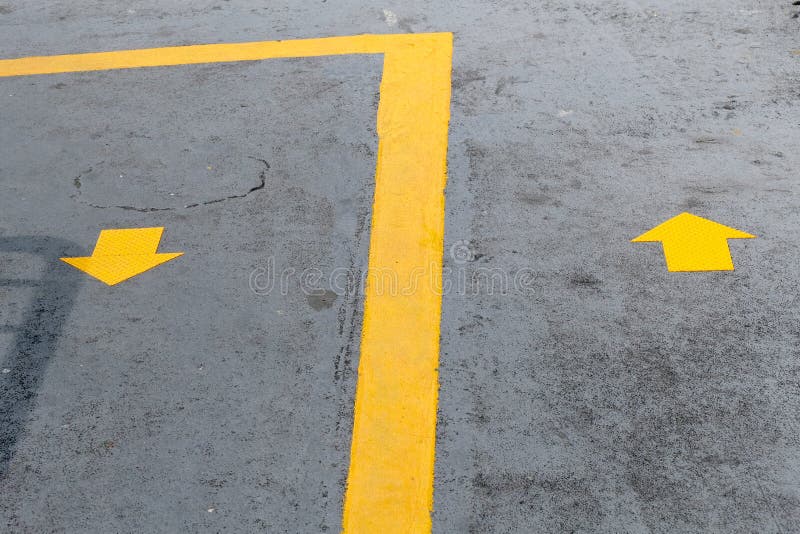 Yellow Arrow Painted in a Pathway. Directional Sign Stock Photo - Image ...