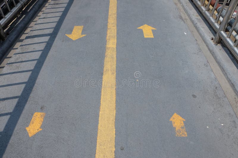 Yellow arrow painted stock image. Image of closeup, information - 227080151