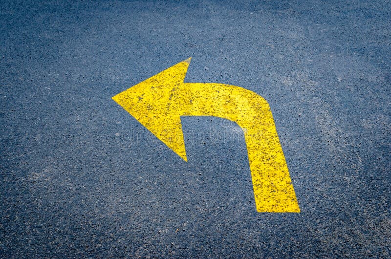 Yellow Arrow on Pavement Pointing Left Stock Photo - Image of turn ...