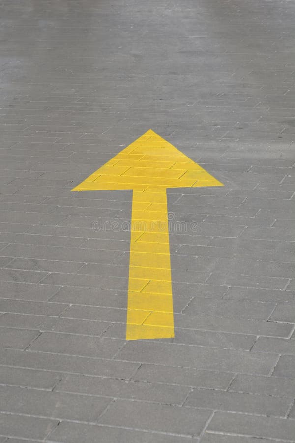 Yellow arrow stock image. Image of traffic, yellow, guidance - 308684131