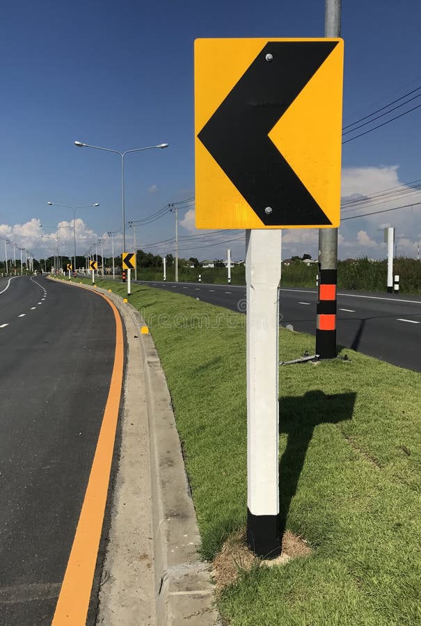 Yellow Arrow Sharp. Curve Warning Sign Stock Photo - Image of drive ...