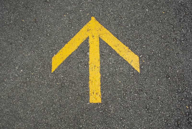 Yellow Arrow Sign Painted on Asphalt or Road Stock Photo - Image of ...