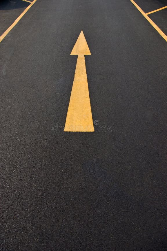 Yellow Arrow Sign on the Road Stock Image - Image of symbol, street ...