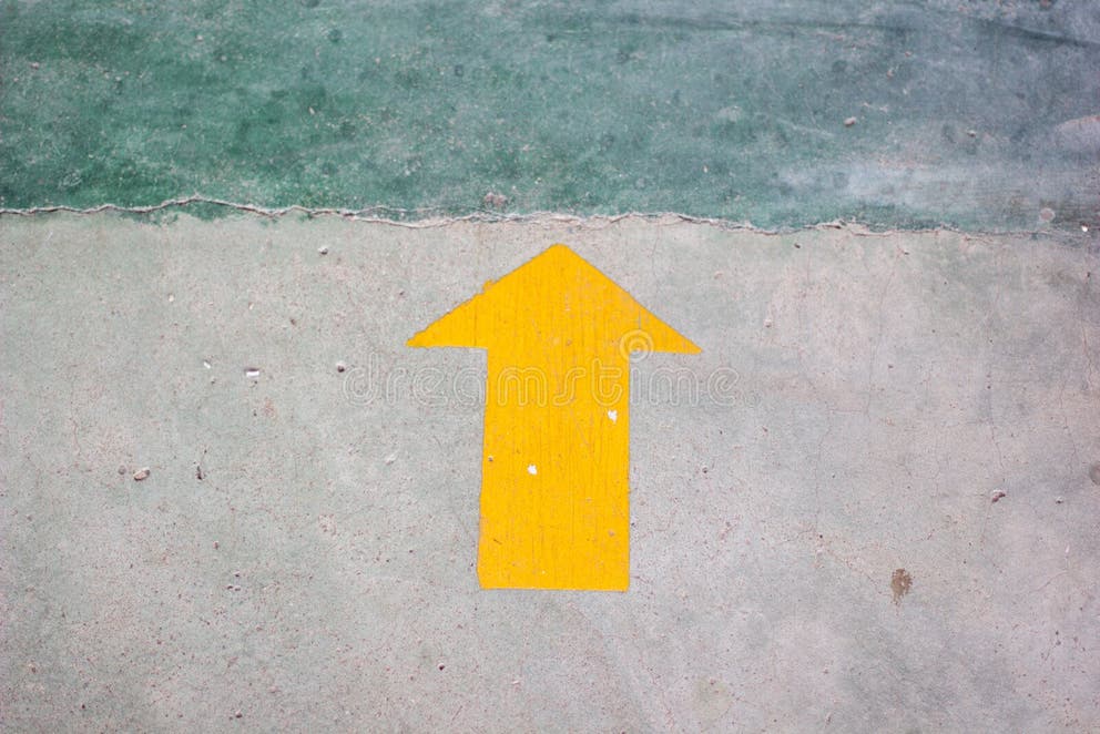 Yellow Arrow Sticker on the Floor with Copy Space Stock Image - Image ...