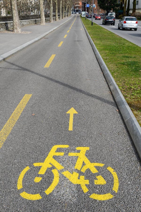 Yellow Arrows and Bicycle Sign of a Cycling Path Editorial Stock Photo ...