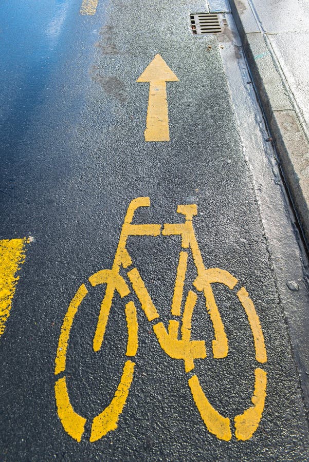Yellow Arrows and Bicycle Sign Path on the Road Stock Image - Image of ...