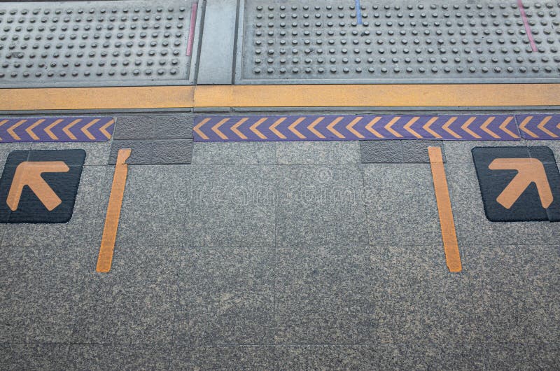 Yellow Arrows Symbol on Platform in Queue Waiting for Train at Sky ...