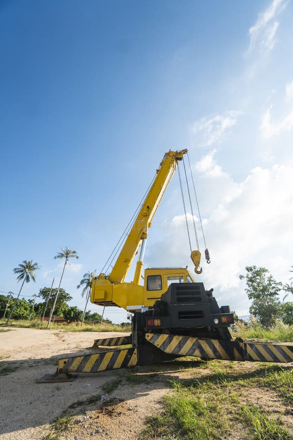 Yellow Automobile Crane with Risen Telescopic Boom Outdoors. Mobile ...