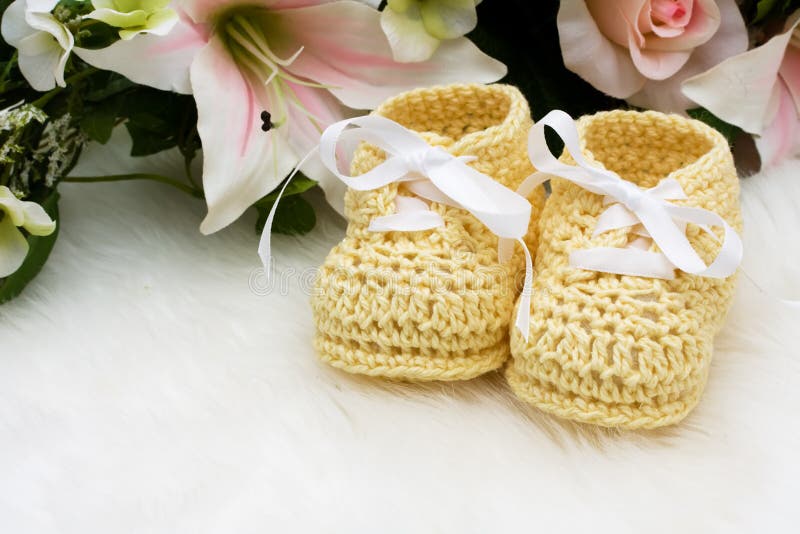 Yellow Baby Booties stock photo. Image of leaves, childcare - 12625906