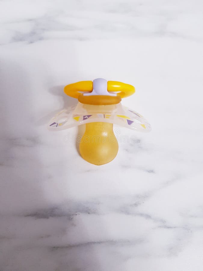 Yellow baby pacifier stock photo. Image of pacify, life - 194521400