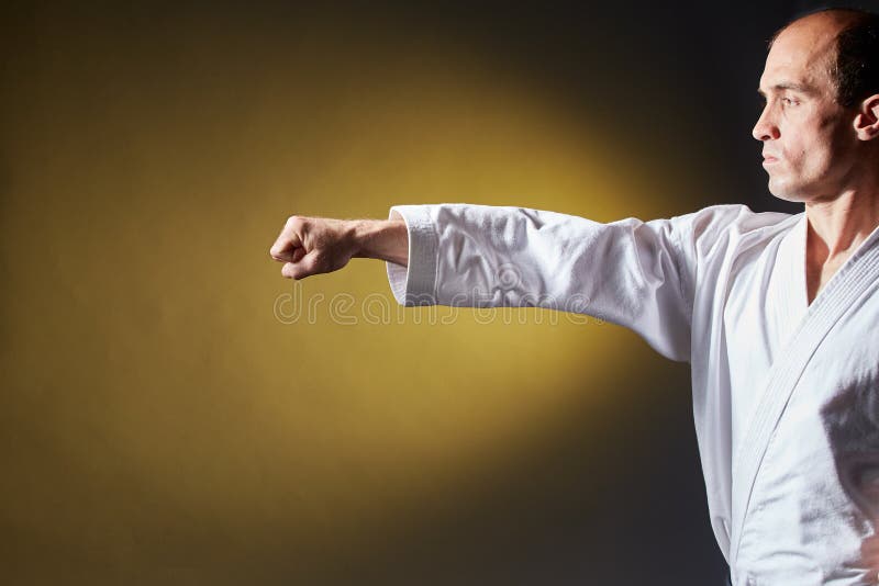 On a Yellow Background, a Young Athlete Beats a Punch Arm Stock Image ...