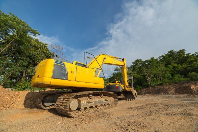 Yellow Backhoe photo stock image. Image of building, blue - 57916105