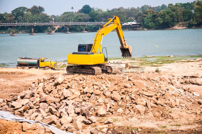 Yellow backhoe work stock image. Image of machinery, quarry - 62372773