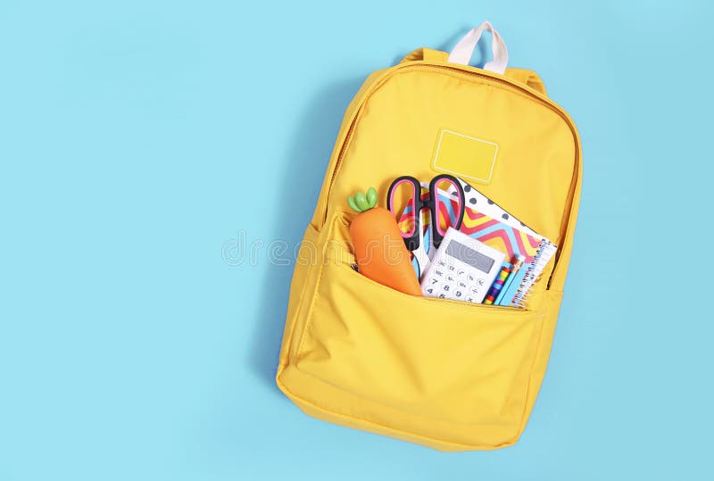 A Yellow Backpack with School Equipment. Back To School Concept ...