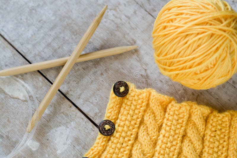 Yellow Ball of Yarn for Knitting in Blue Plate and Stock Photo - Image ...