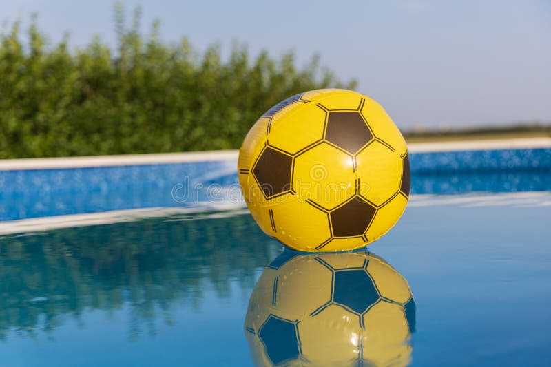Yellow Balloon on the Surface of the Water in the Pool Stock Photo ...