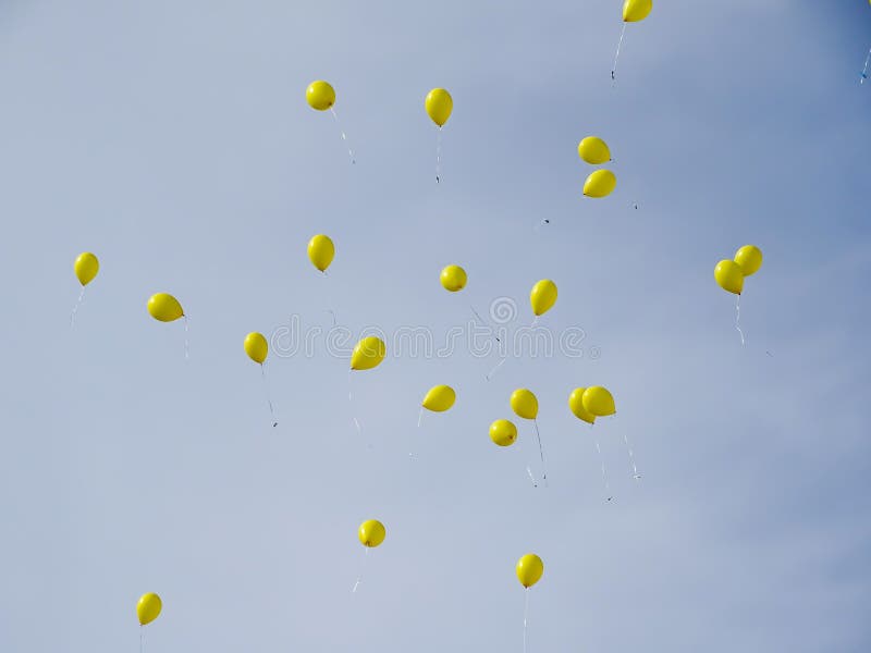 Yellow Balloons Fly in the Sky Stock Photo - Image of flying, yellow ...
