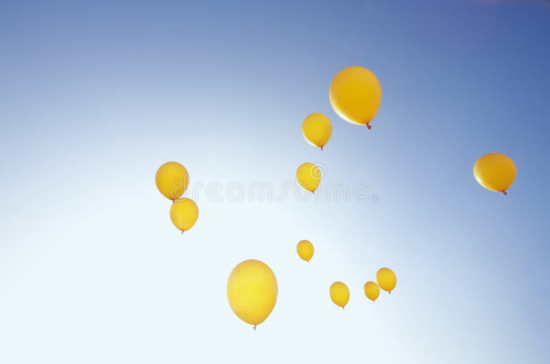 Yellow Balloons in Sunny Blue Sky Stock Photo - Image of colorful ...
