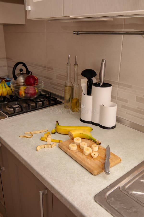 Yellow Banana on a Kitchen Table Cut into Pieces Stock Image - Image of ...