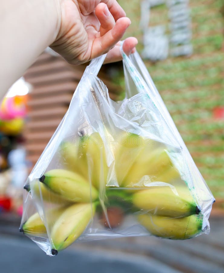 Yellow Bananas in a Package in a Hand Stock Photo - Image of plastic ...