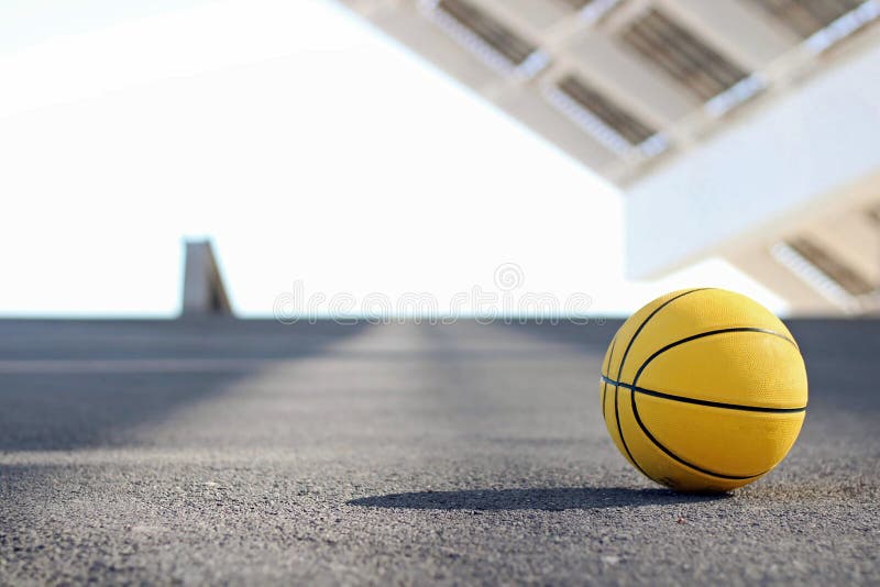 Yellow Basketball on an Asphalt Ground Stock Photo - Image of lifestyle ...