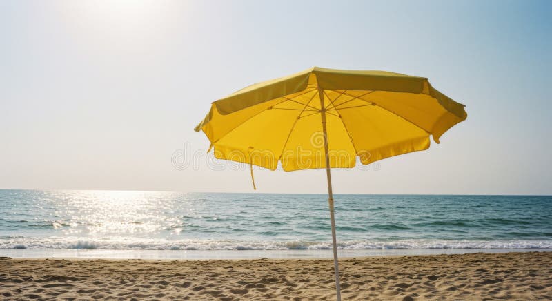 Yellow Beach Umbrella on Sandy Shore Under Bright Sunlight Stock ...