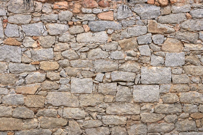 A Yellow Beige Natural Stone Wall of Different Sized Stones ...