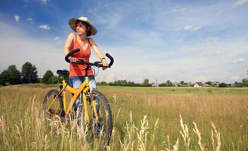 Yellow bicycle stock photo. Image of clouds, cloud, green - 5524036