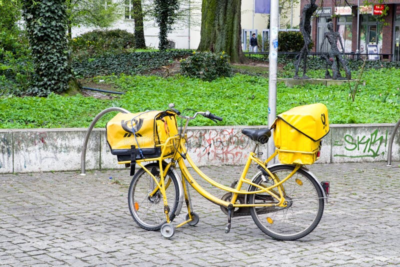 Yellow Bicycle of Postman from Deutche Post, Berllin Editorial Image ...