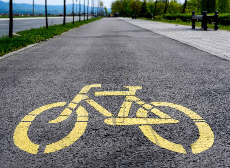 Yellow bicycle sign stock image. Image of path, sidewalk - 93811817