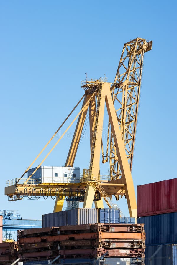 Yellow Big Crane Operates in a Warehouse at the Seaport Stock Photo ...