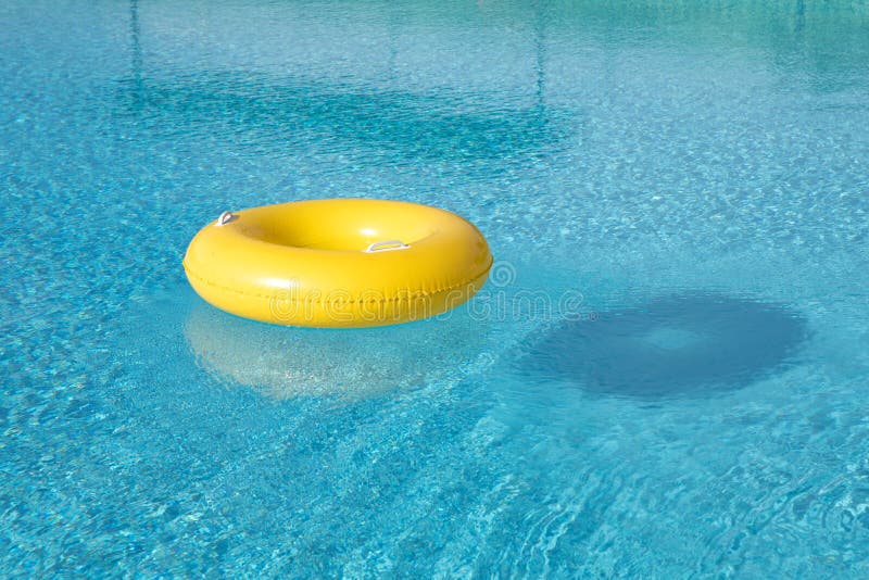 Yellow big float on pool stock photo. Image of transparent - 182010644