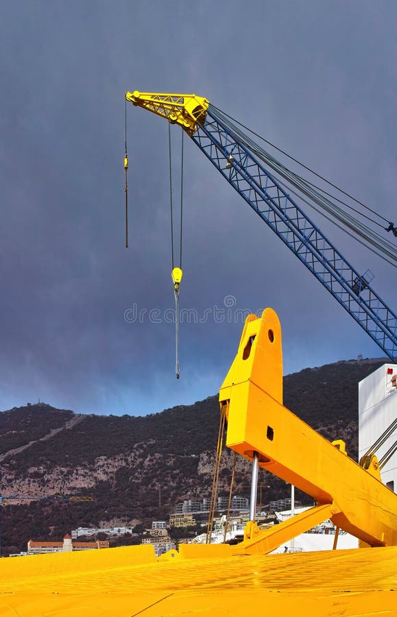 Yellow Big Roro Vessel in a Shipyard with a Crane Against Grey Sky ...